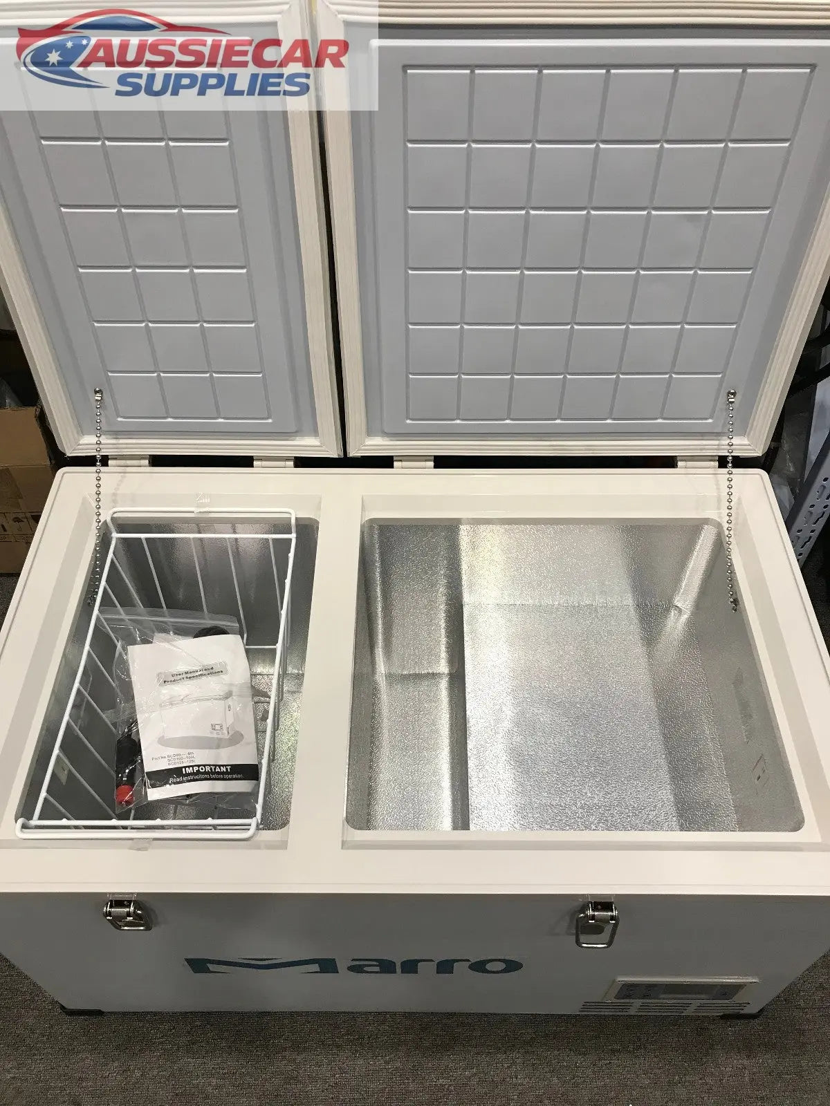 Open 35L freezer with 'Marro' branding on a carpeted floor