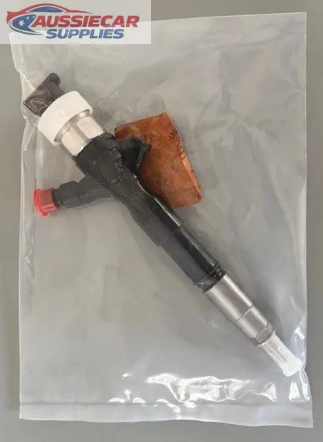 Mechanical injector toyota V8 device in a clear plastic bag on a gray ...