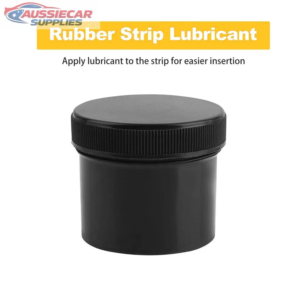 Black container with a black lid on a white background, labeled 'Rubber ...